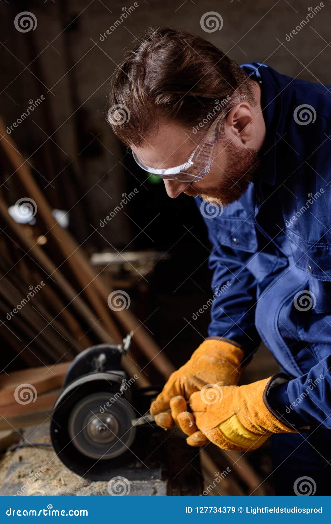 Worker in Protective Googles and Gloves Using Grinding Machine Stock ...
