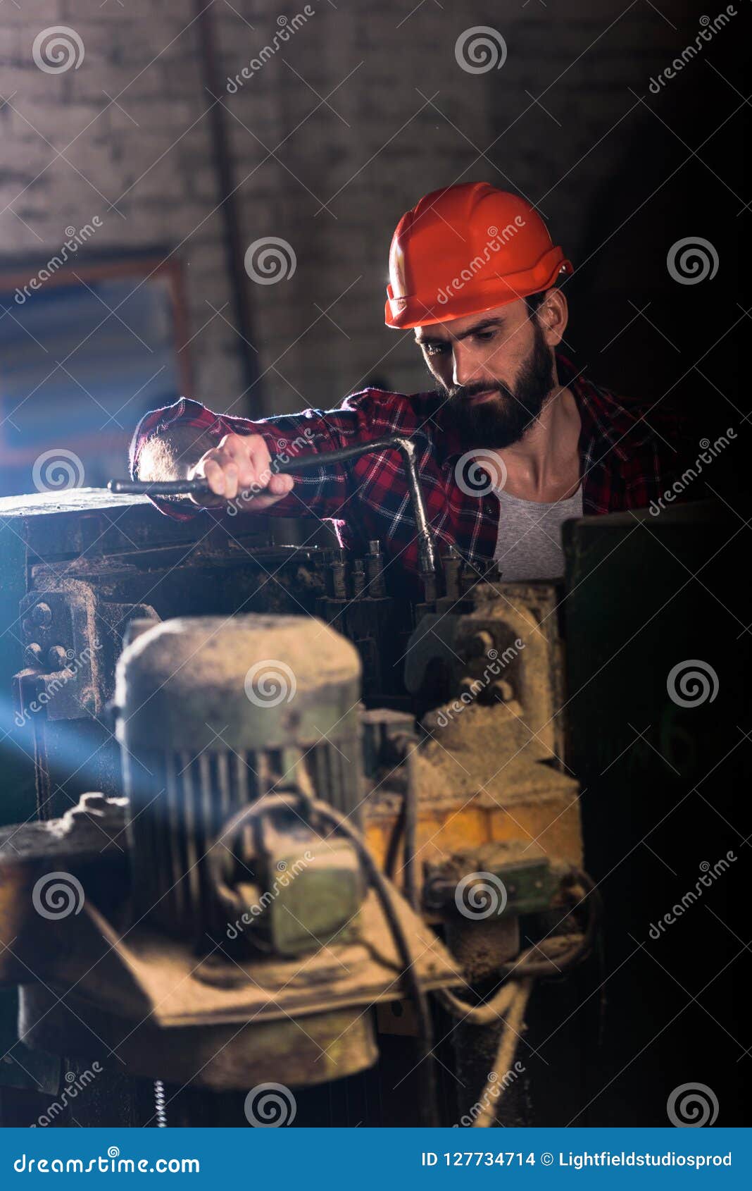Worker in Protective Helmet Repairing Machine Tool Stock Photo - Image ...