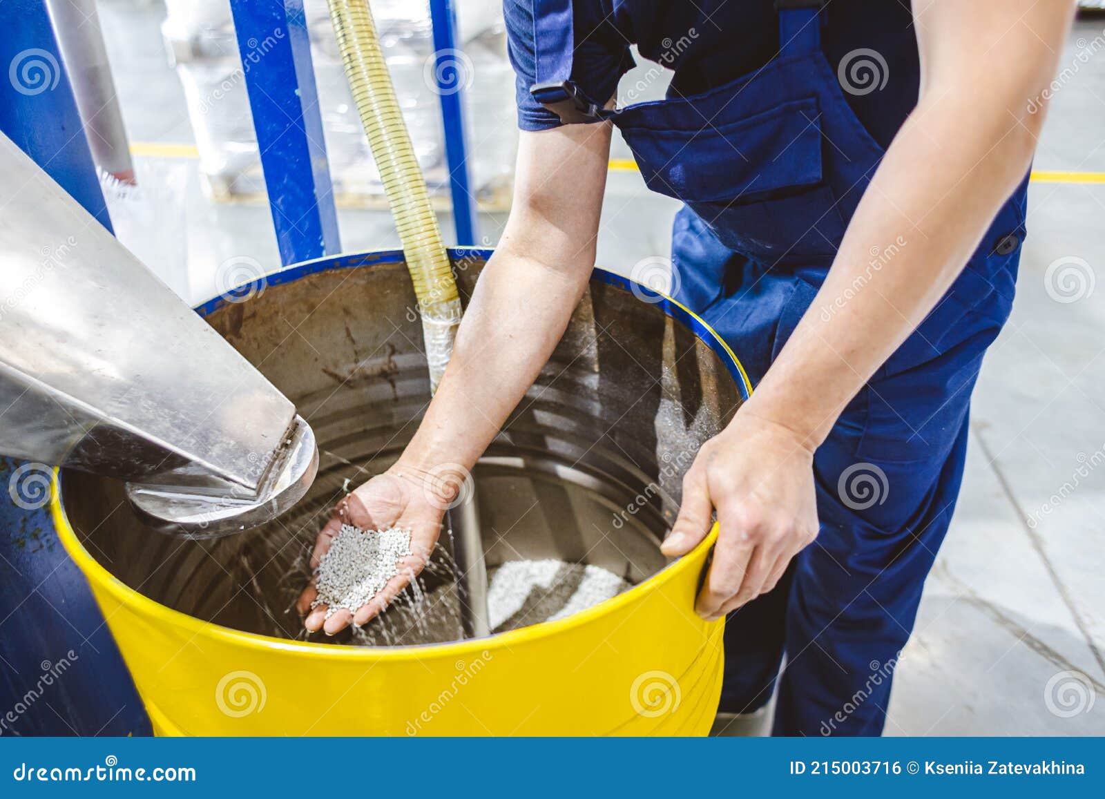 A Worker in Protective Overalls Checks the Technological Process of ...