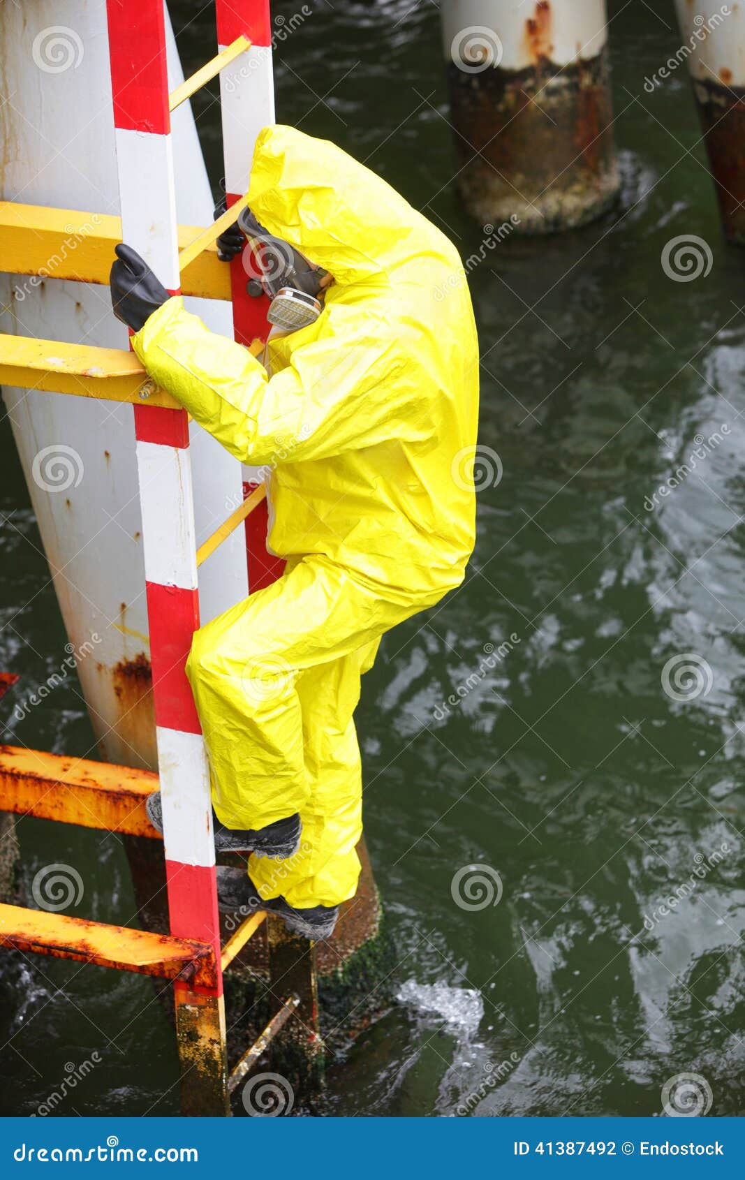 Worker in Protective Suit Climbing Ladder Over the Sea Stock Photo ...