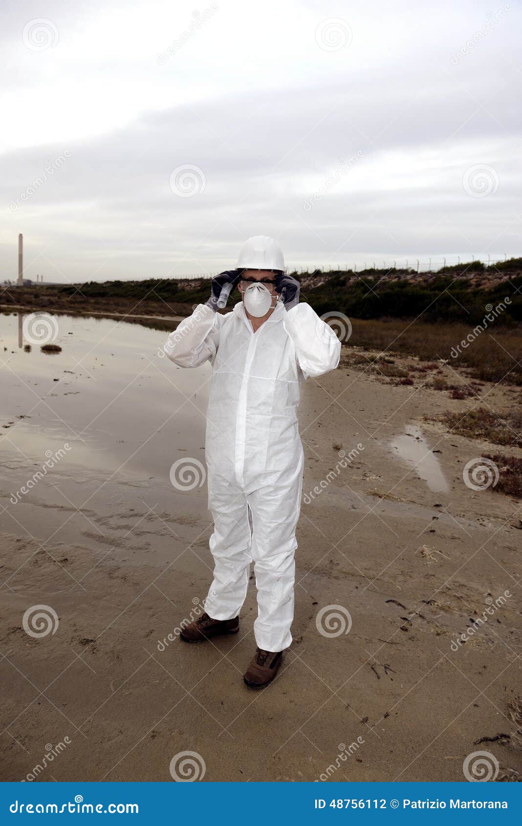 Worker in a Protective Suit Examining Pollution Stock Photo - Image of ...