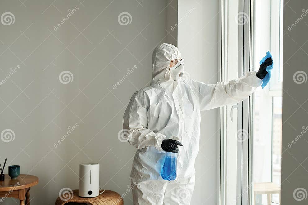 Worker in Protective Suit Wiping Windowws Stock Image - Image of ...