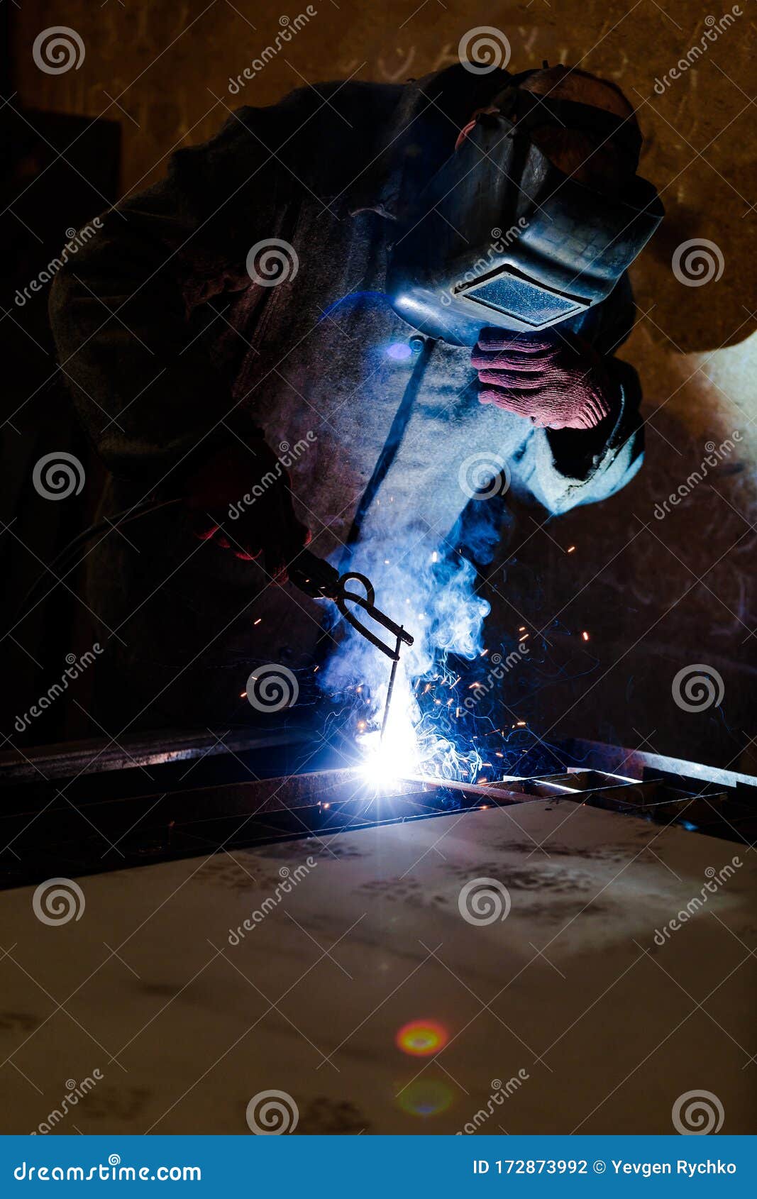 Worker in Protective Uniform and Mask Welding Metal. Stock Photo ...