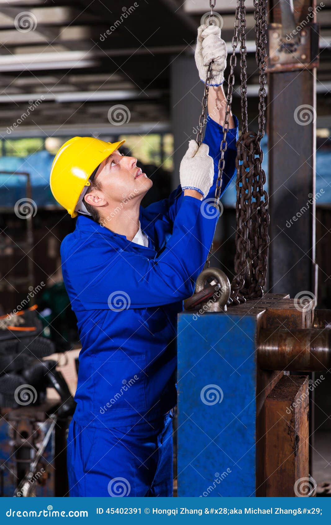 Worker pulling chains stock image. Image of helmet, modern - 45402391