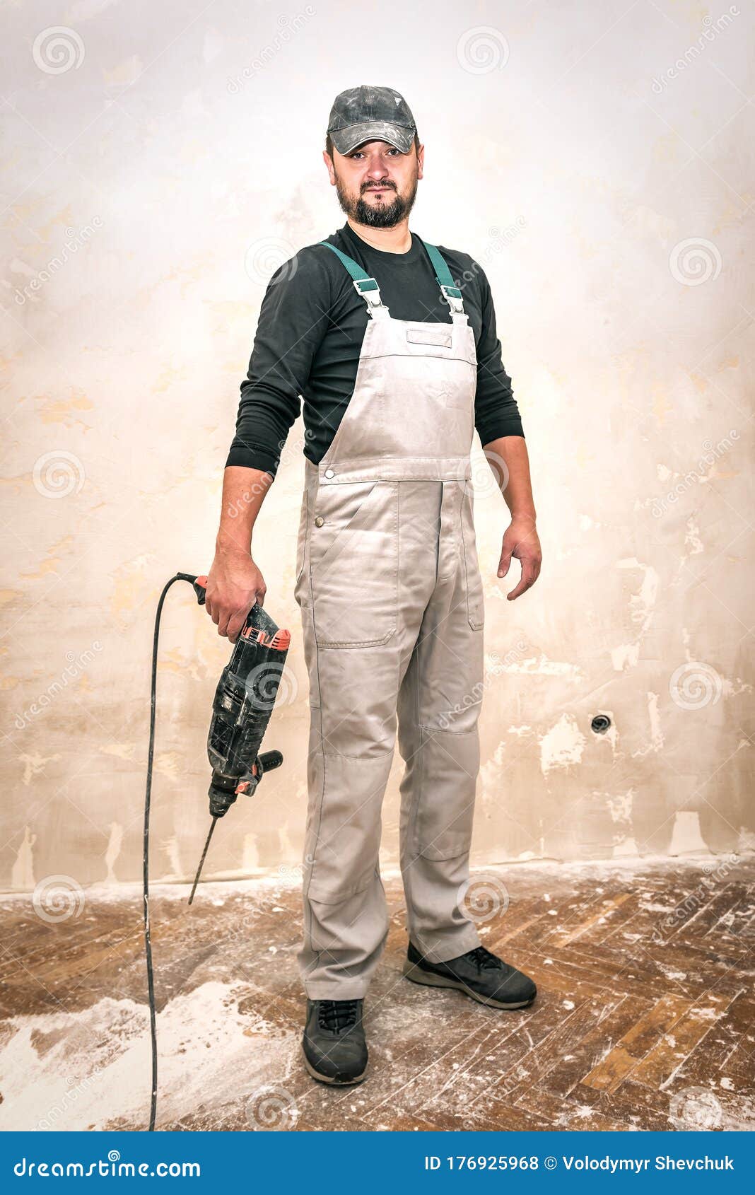 Worker with a punch stock photo. Image of engineer, perforator - 176925968