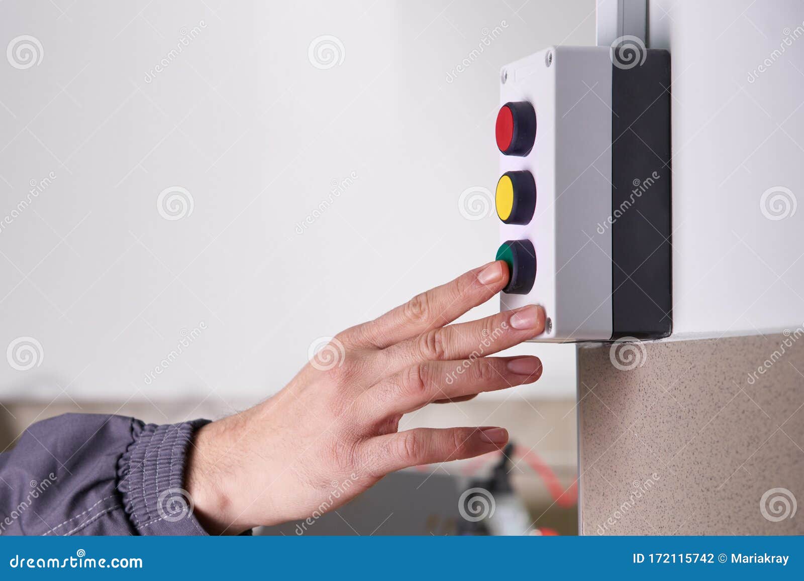Worker Pushing Green Button Operating a Machine in a Factory, Close Up ...