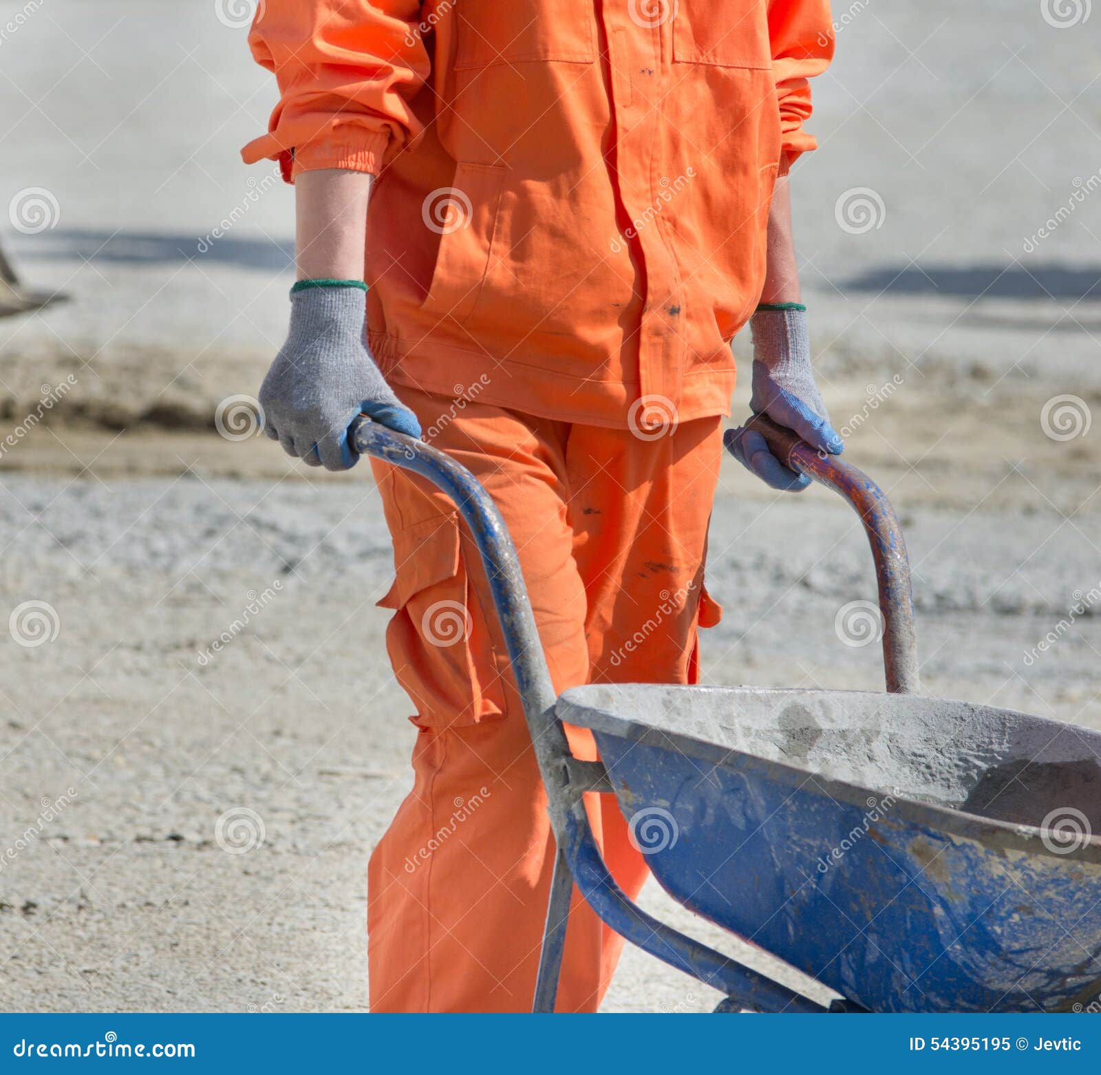 Worker pushing wheelbarrow stock image. Image of labor - 54395195