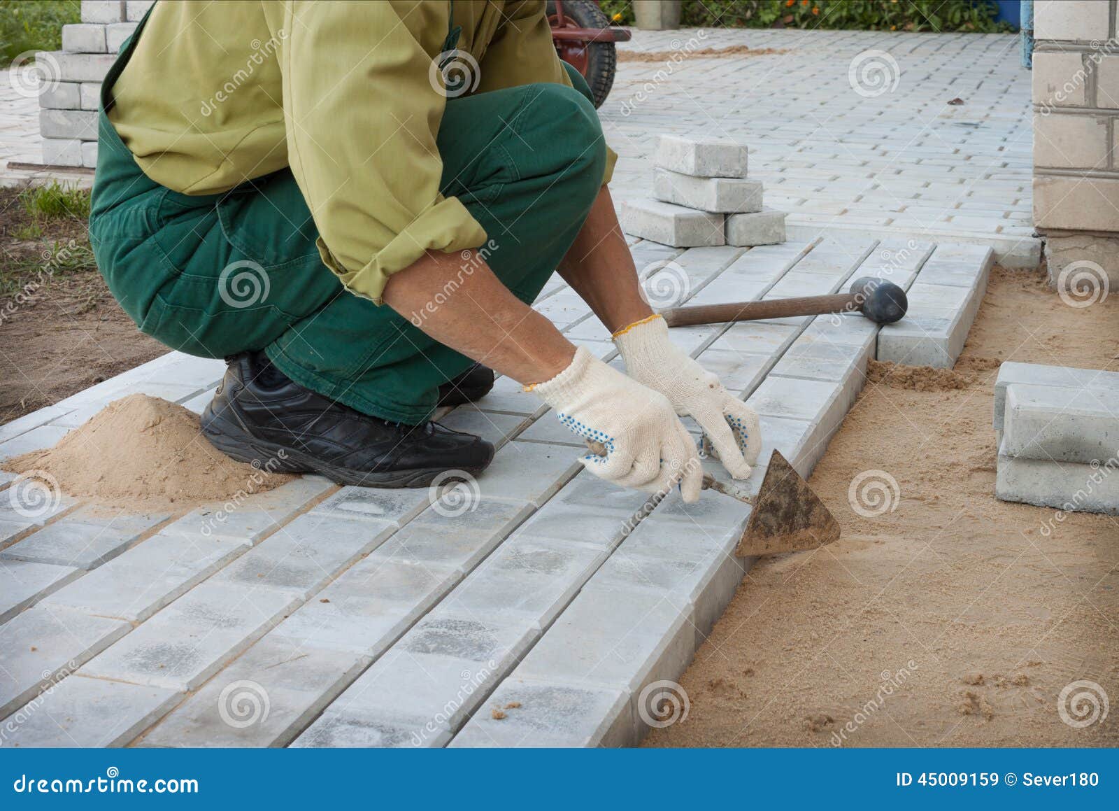 Worker Puts the Blocks on the Sidewalk Stock Image - Image of hammer ...