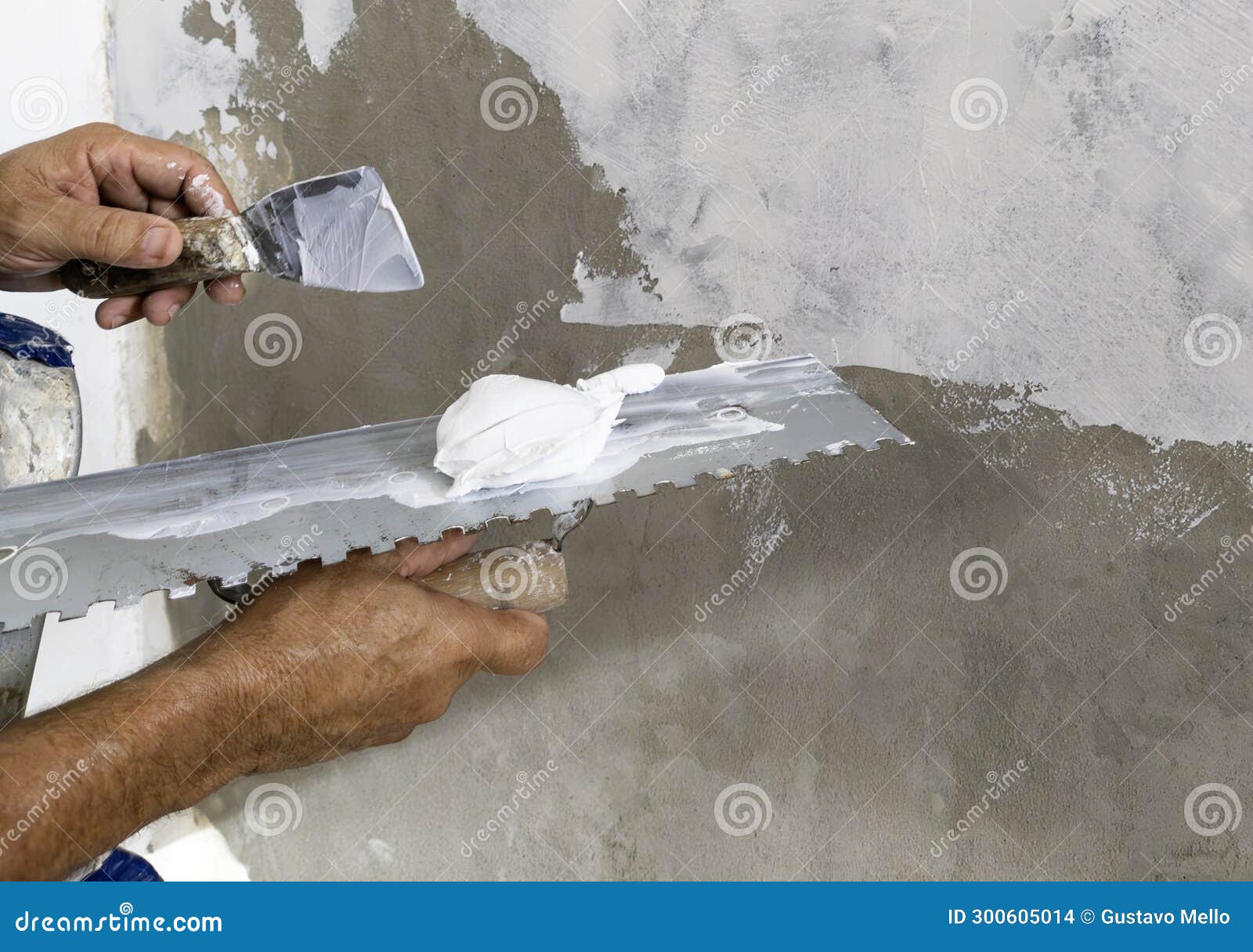 Worker Puts Finishing Layer of Stucco on the Wall Using a Plastering ...