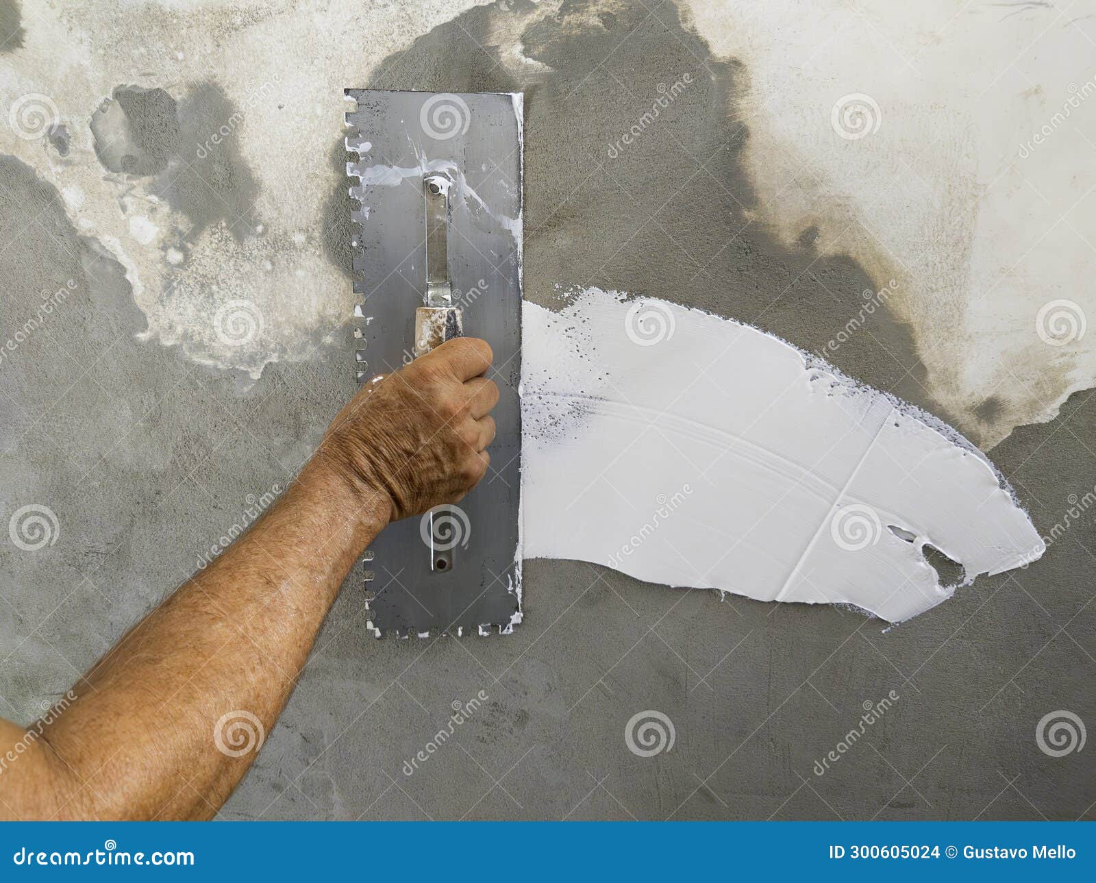 Worker Puts Finishing Layer of Stucco on the Wall Using a Plastering ...