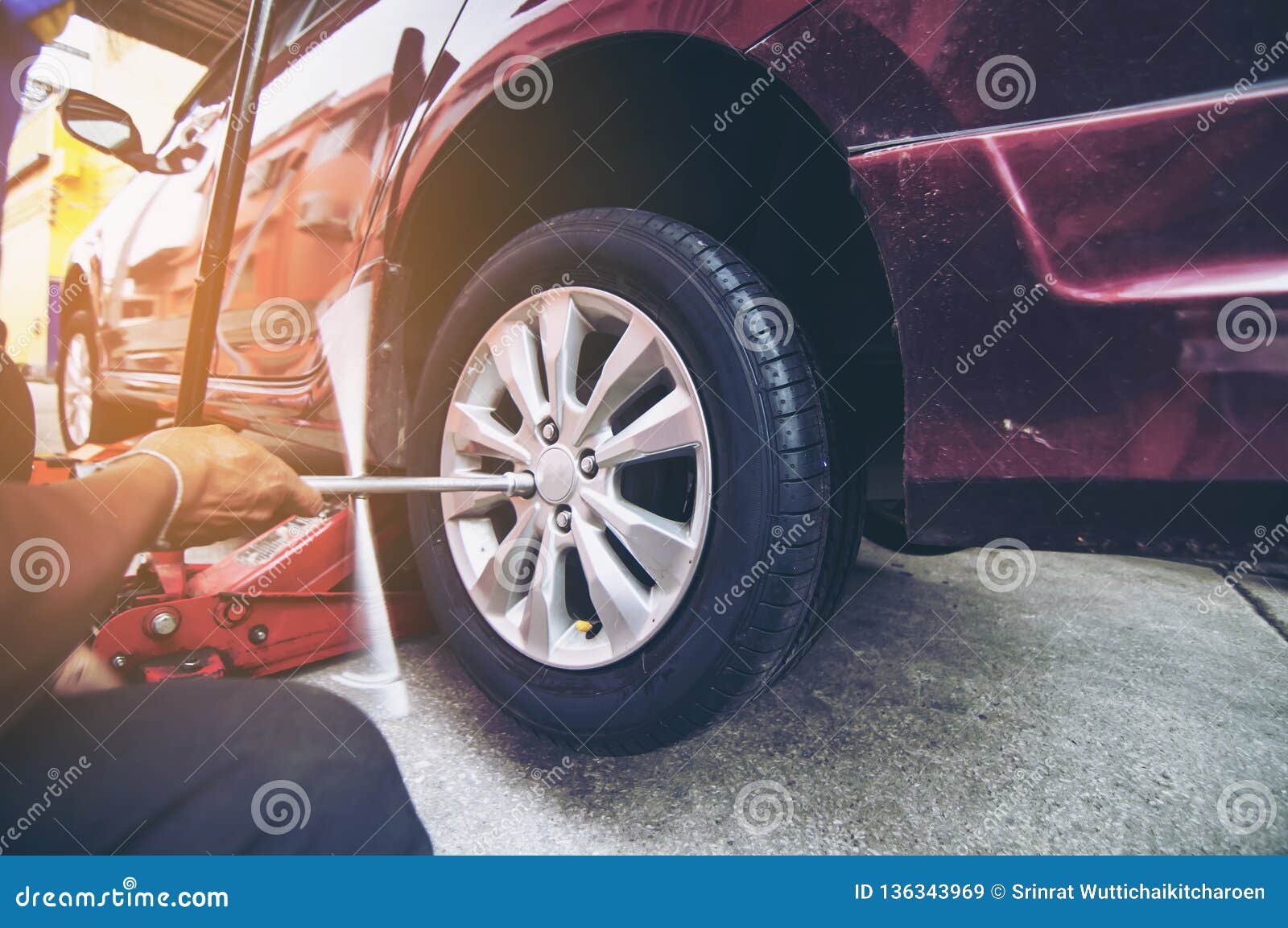 Worker Putting New Wheel To the Car Stock Image - Image of shine, auto ...