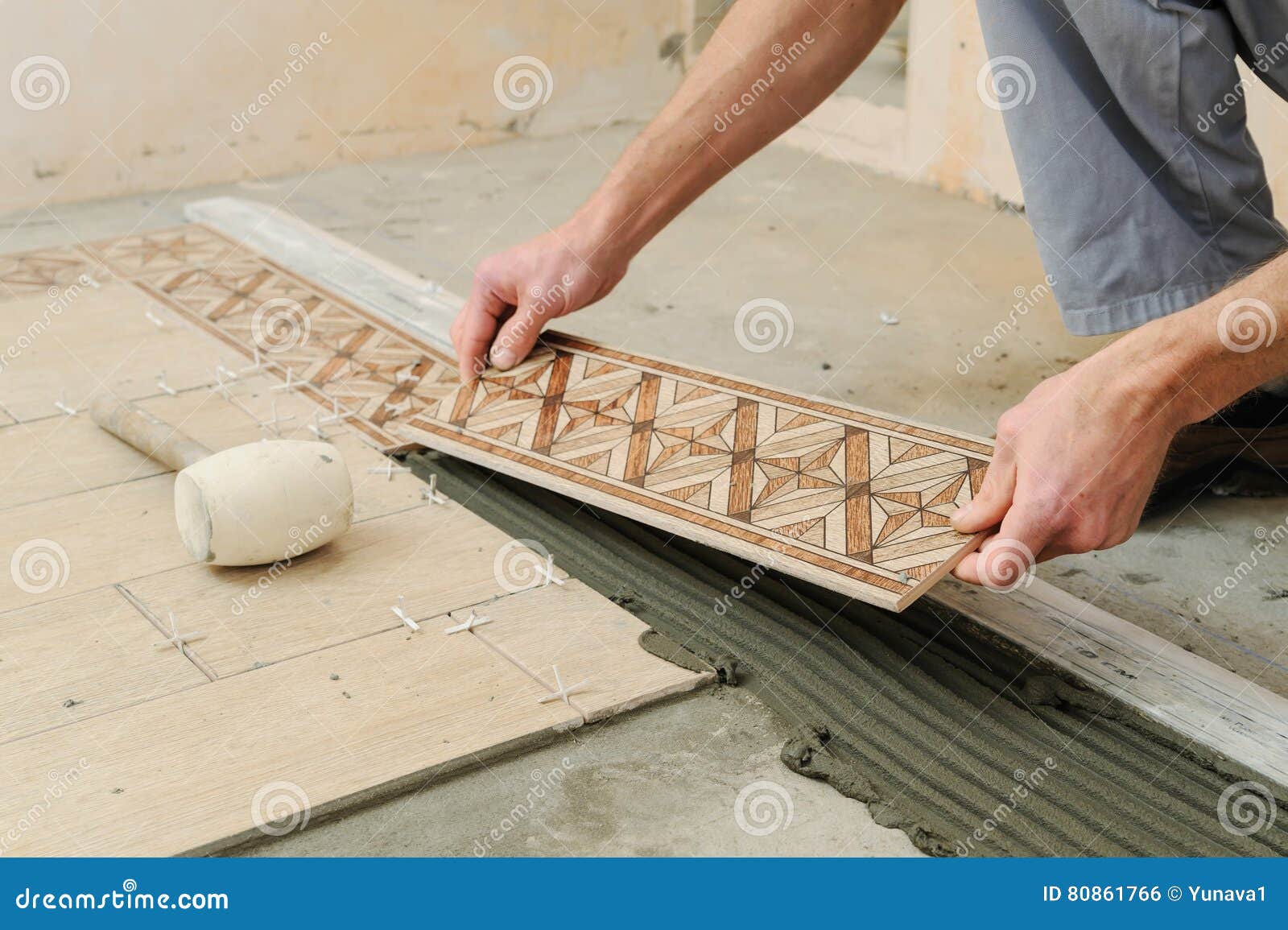 Worker Putting Tiles on the Floor. Stock Photo - Image of glue ...