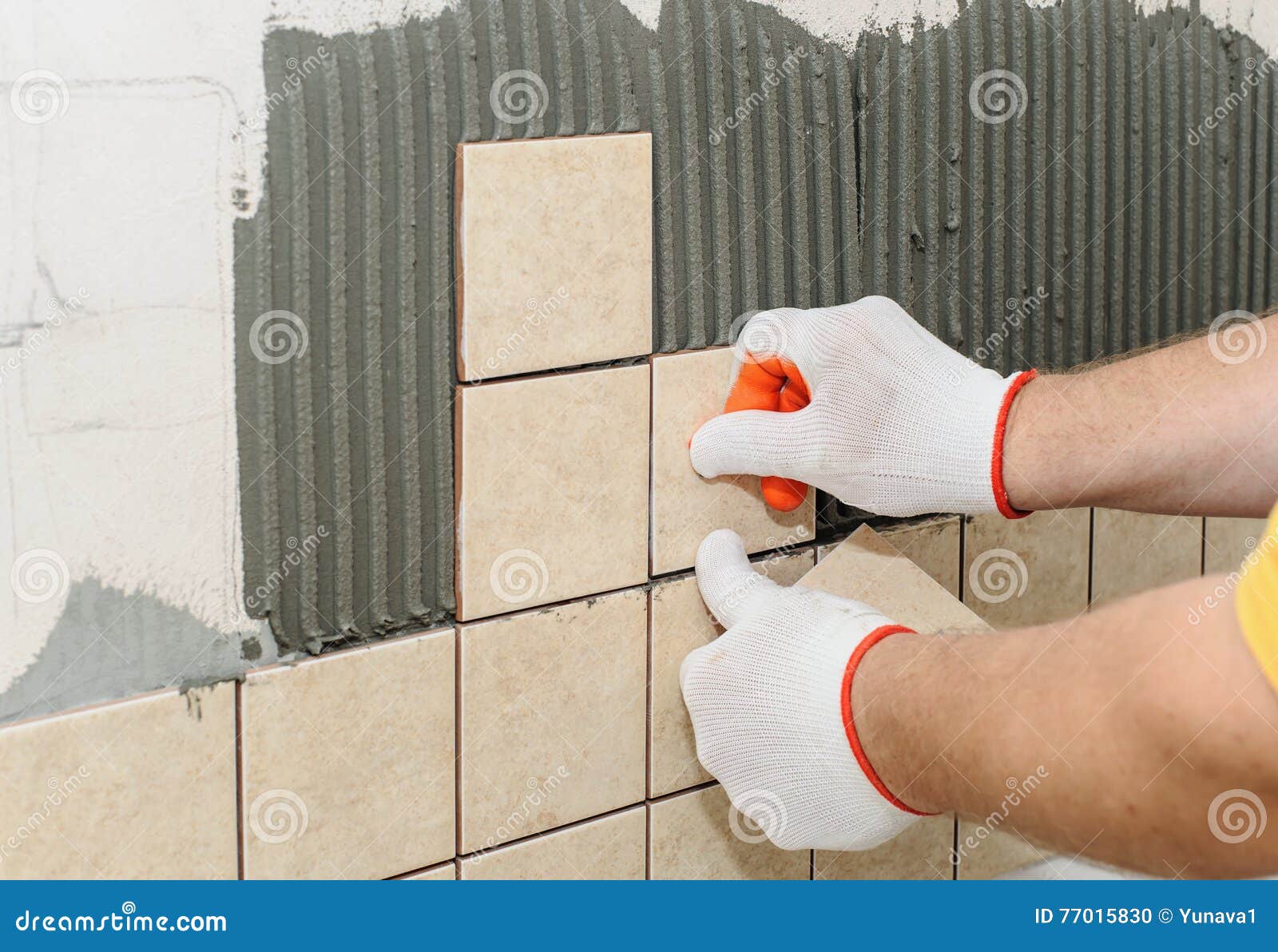 Worker Putting Tiles on the Wall in the Kitchen. Stock Photo - Image of ...