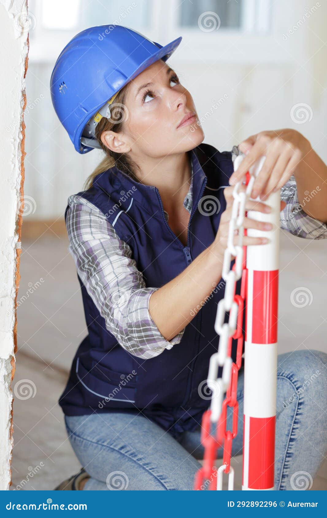 Worker Putting Up Exclusion Chain on Construction Site Stock Photo ...