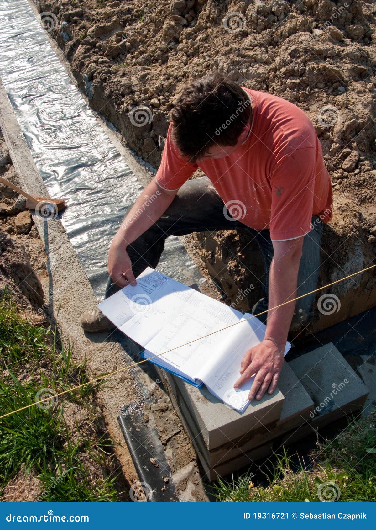Worker reading blueprints stock image. Image of blueprint - 19316721