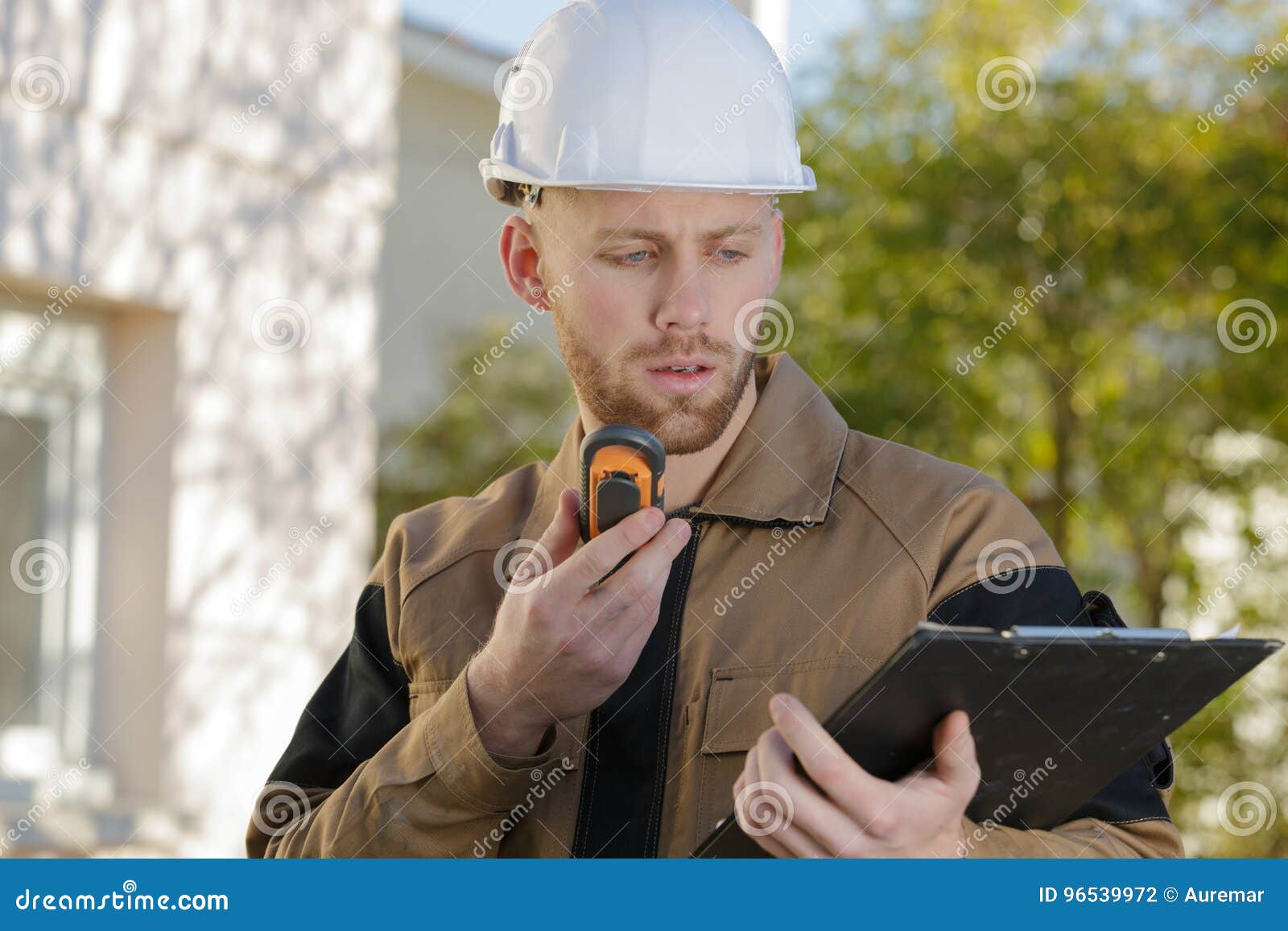 Worker Recording Details from Folder Stock Photo - Image of ...