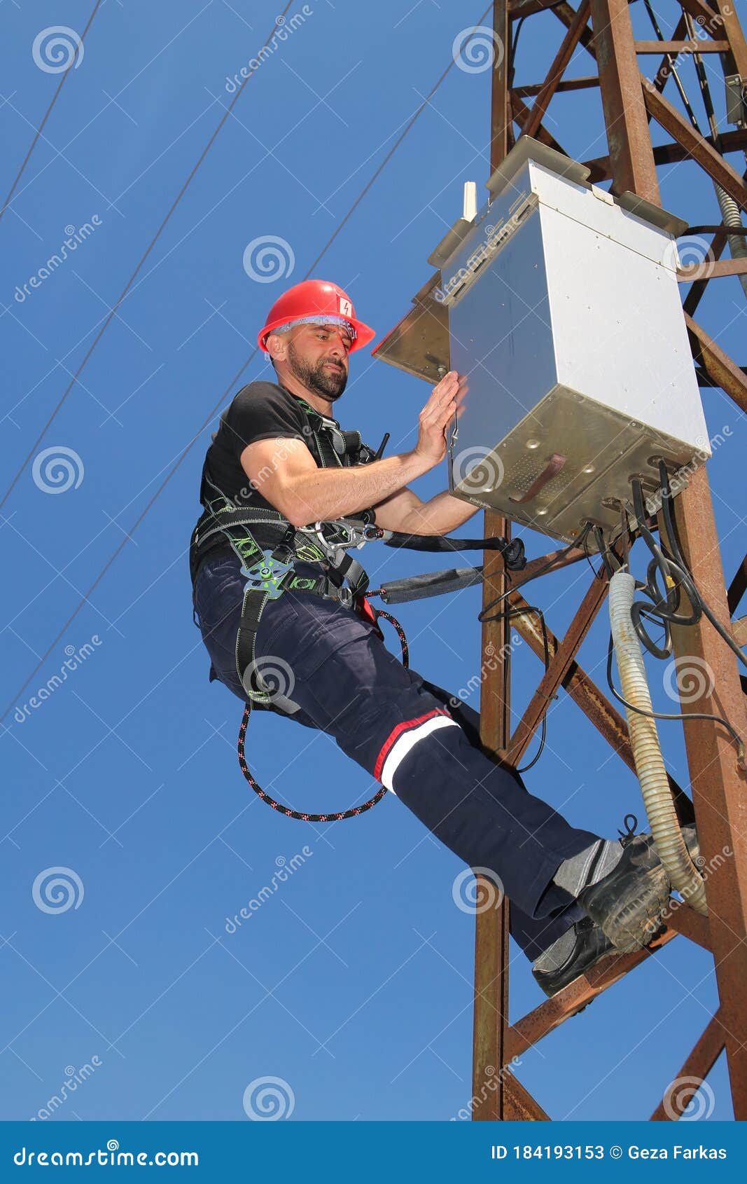 Worker in Red Helmet Working on Power Transmission Line Stock Image ...