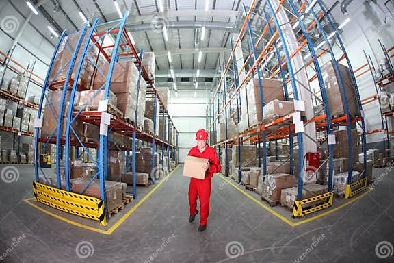 Worker in Red Uniform with Box in Warehouse Stock Photo - Image of ...