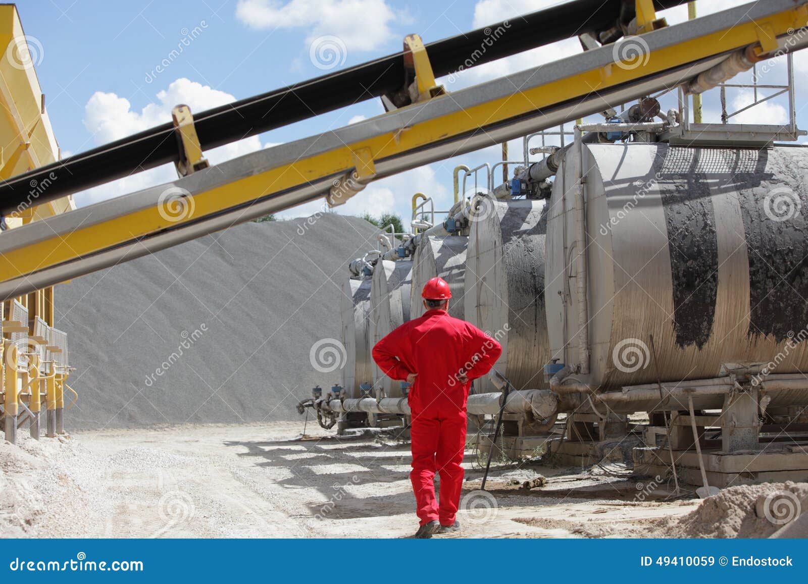 Worker in Red Uniform at Tanks with Asphalt Stock Image - Image of ...