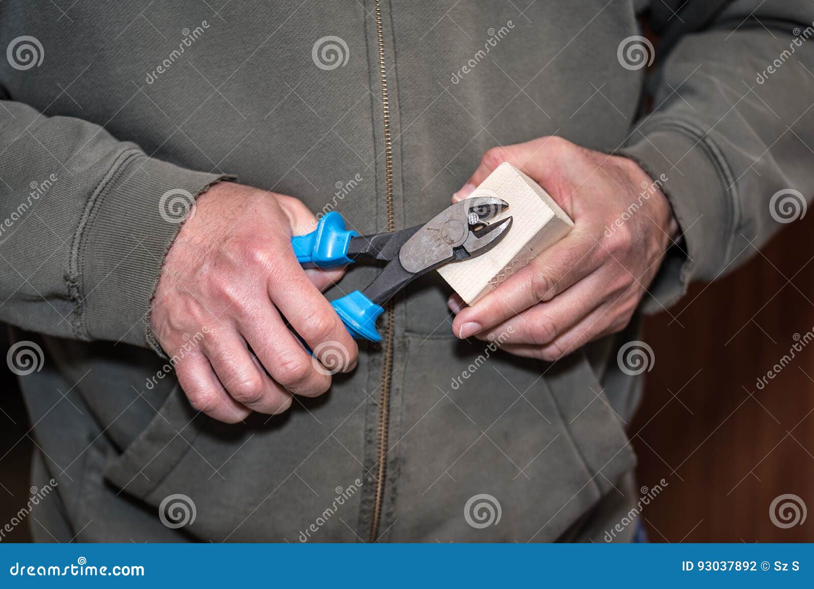 Worker Remove a Nail from Wooden Workpiece Stock Photo - Image of ...