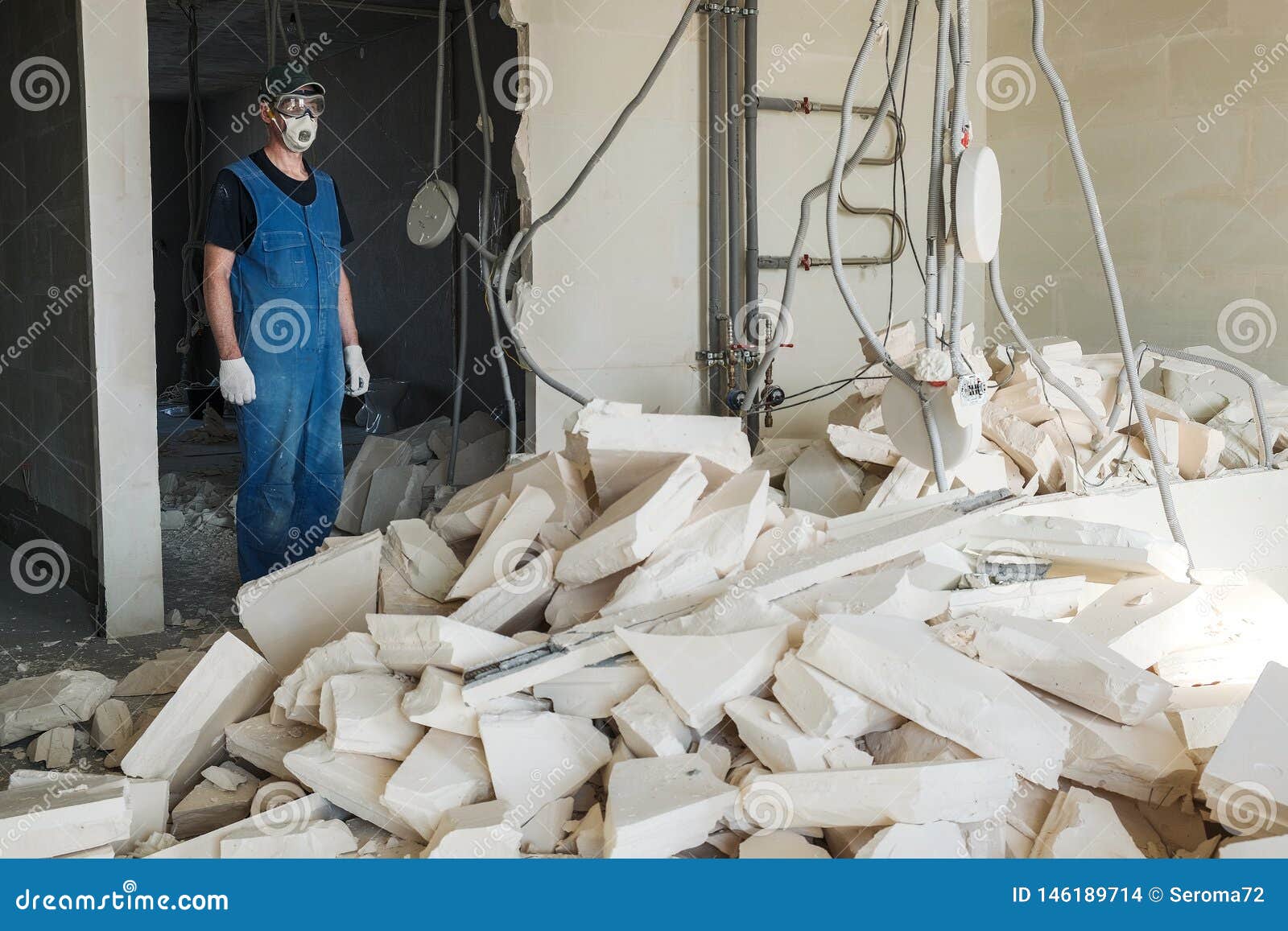 Worker Removes Debris from the Destroyed Wall Stock Photo - Image of ...