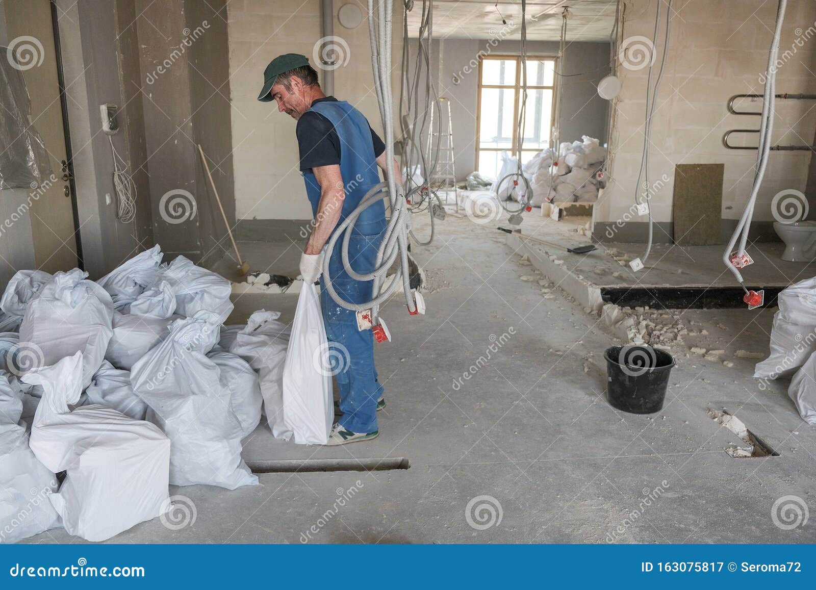 Worker Removes Debris from the Destroyed Wall Stock Image - Image of ...