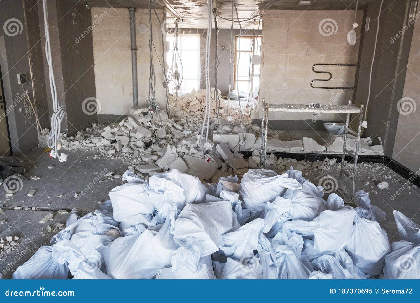 Worker Removes Debris from the Destroyed Wall Stock Image - Image of ...
