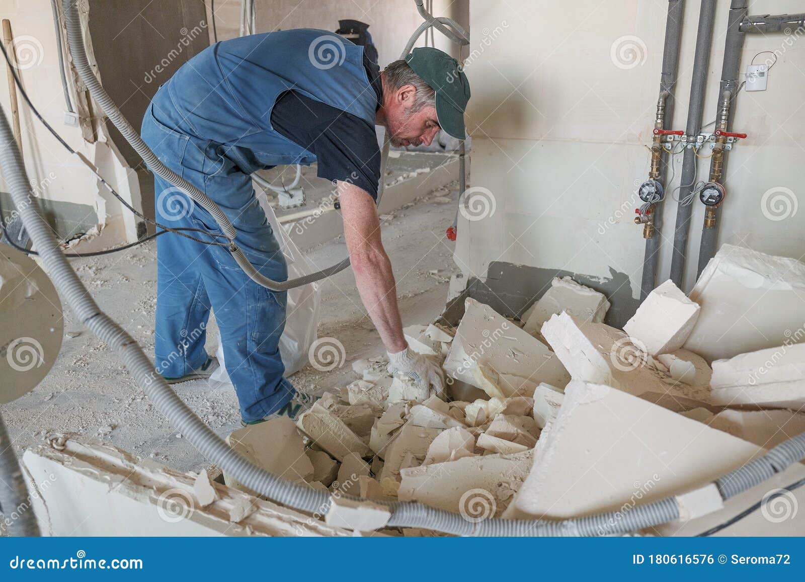 Worker Removes Debris from the Destroyed Wall Stock Photo - Image of ...