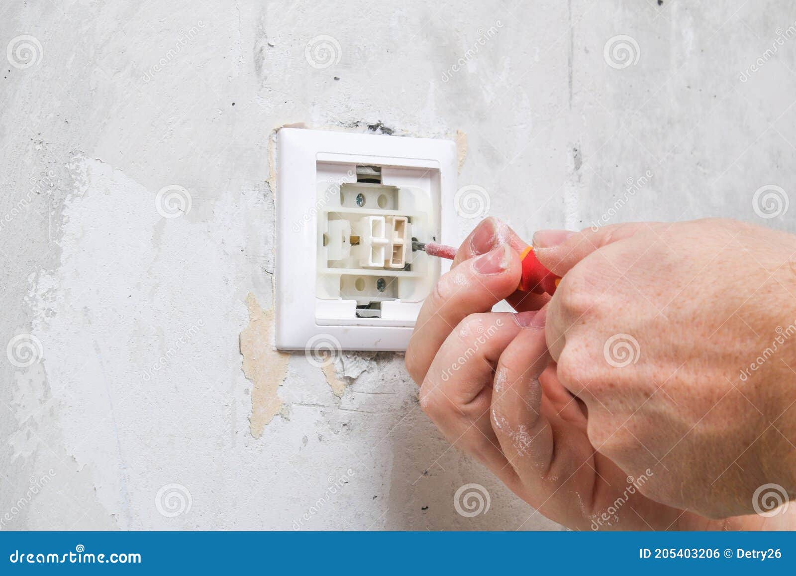 A Worker Removes Light Switch for Wallpapering. Stock Photo - Image of ...