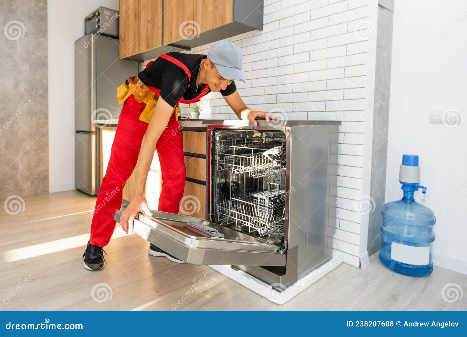 Worker Repair Dishwasher at Home. Stock Photo - Image of mechanic ...