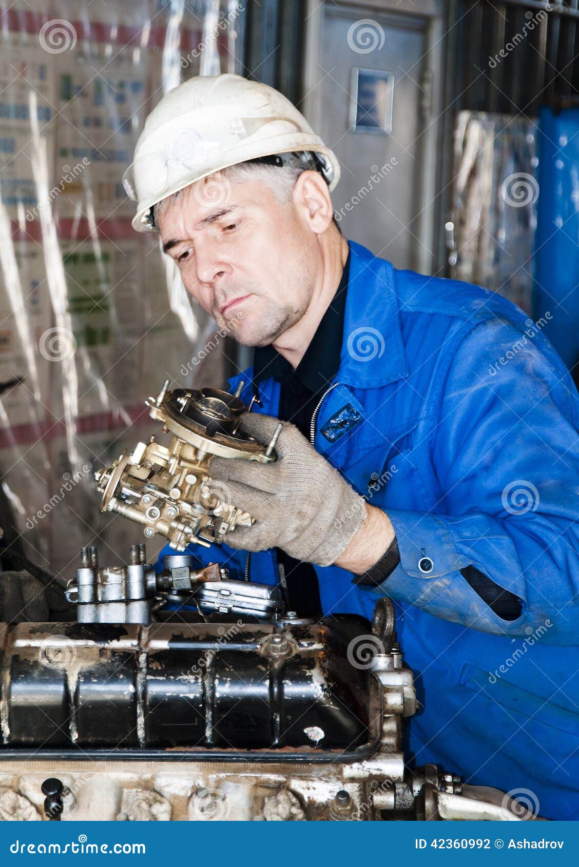 Worker repair the motor stock photo. Image of garage - 42360992