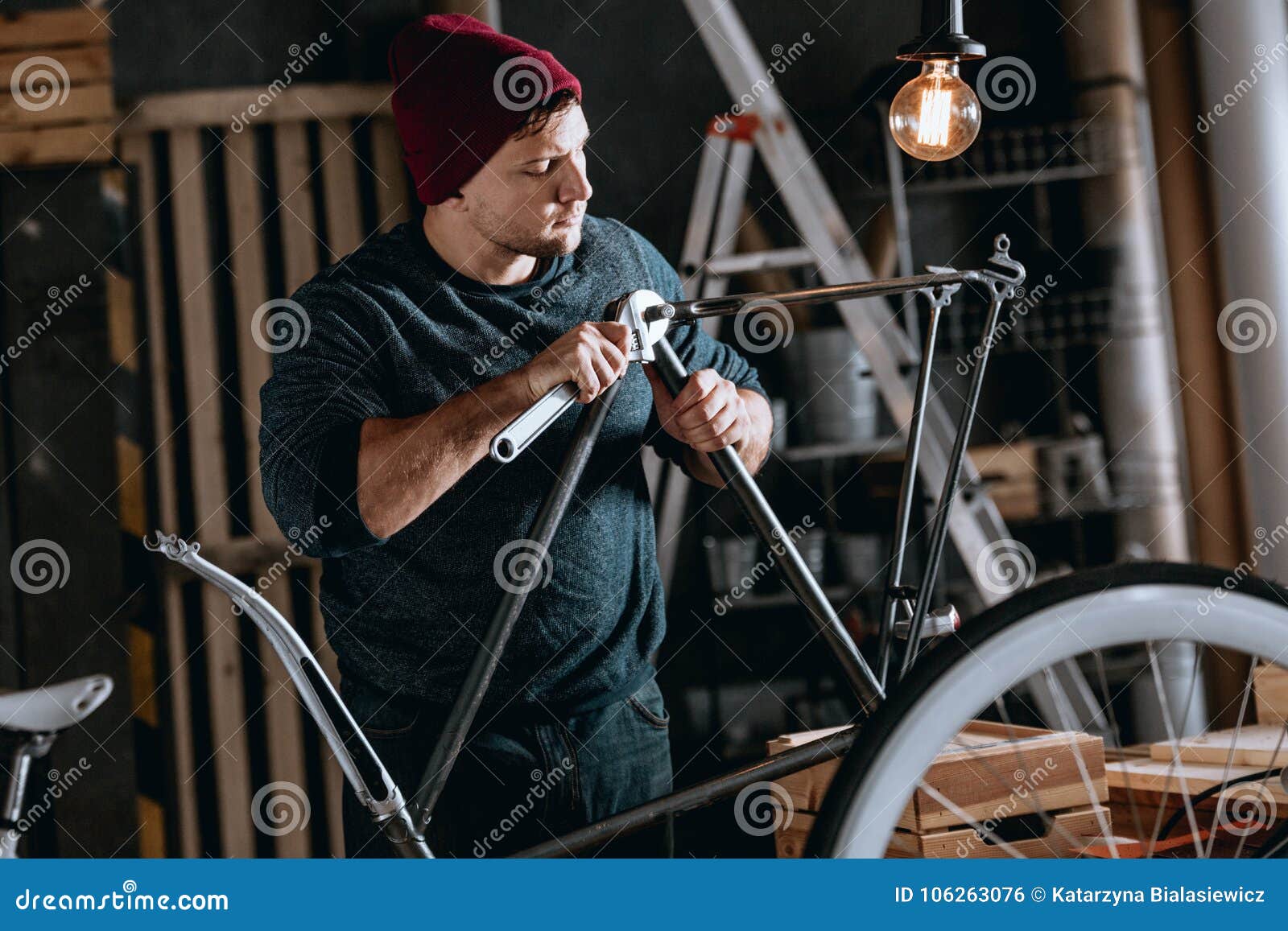 Worker repairing bike stock photo. Image of repair, male - 106263076