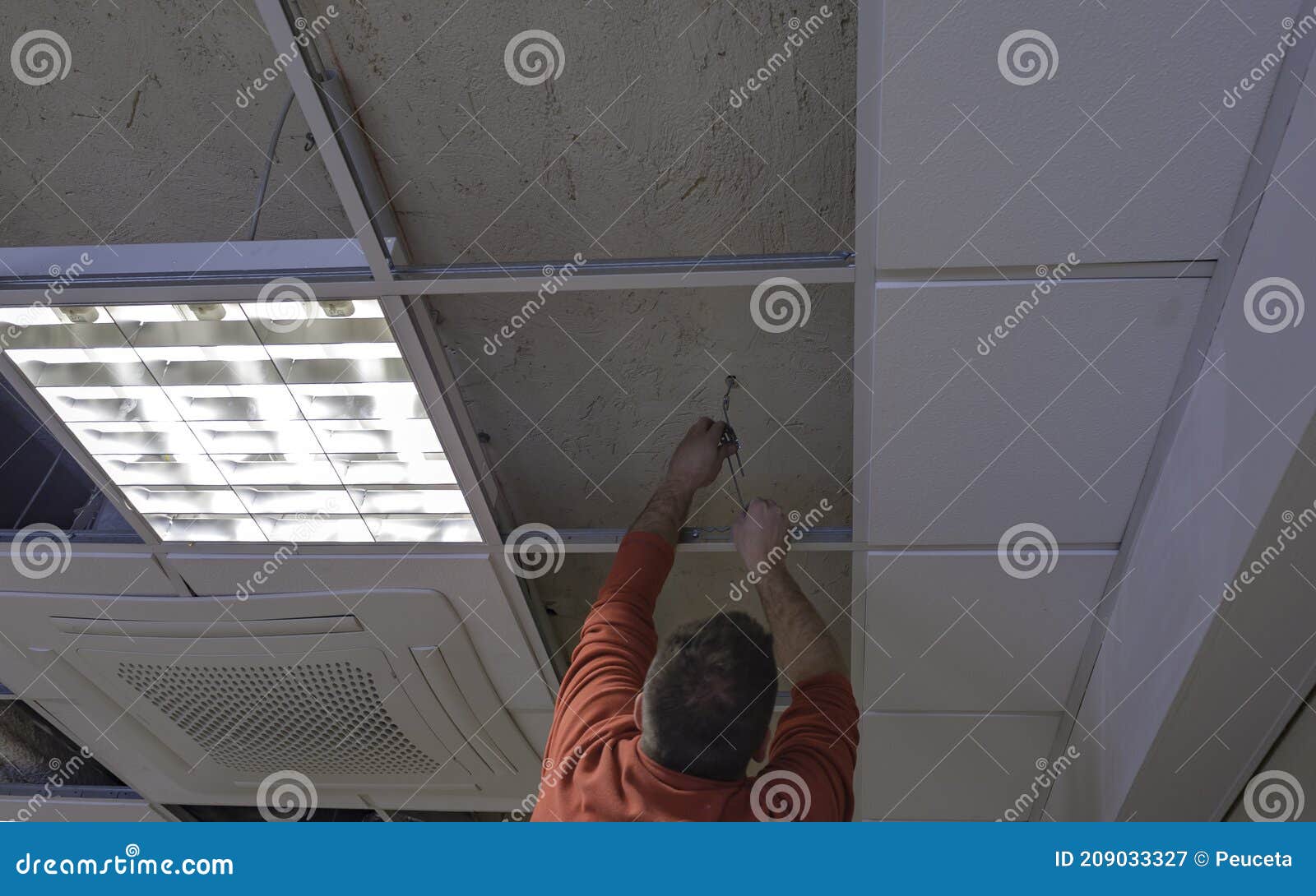 Worker Repairing Board Ceiling with Gypsum. in the Classroom Stock ...