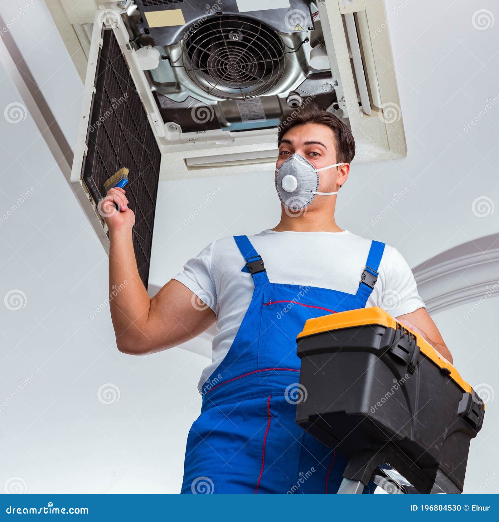 Worker Repairing Ceiling Air Conditioning Unit Stock Photo - Image of ...