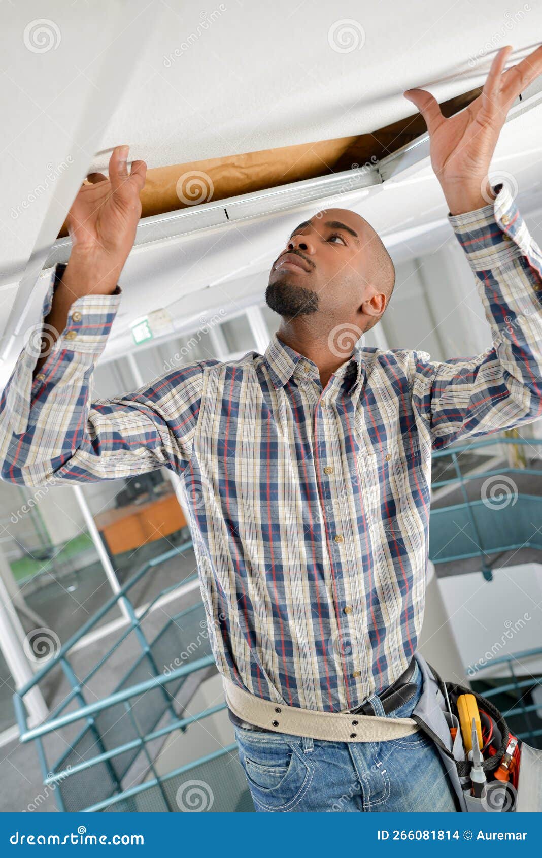 Worker repairing ceiling stock photo. Image of hands - 266081814