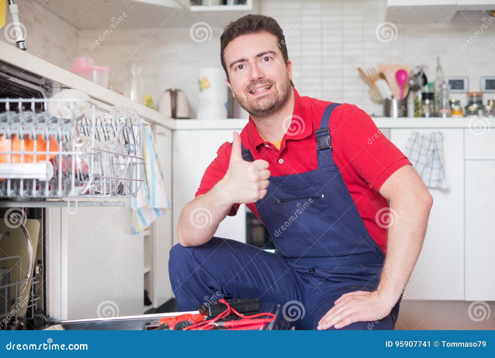 Worker Repairing the Dishwasher in the Kitchen Stock Image - Image of ...