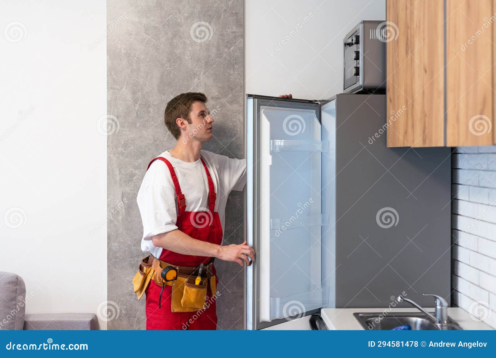 Worker Repairing Fridge in Kitchen Stock Photo - Image of problem ...