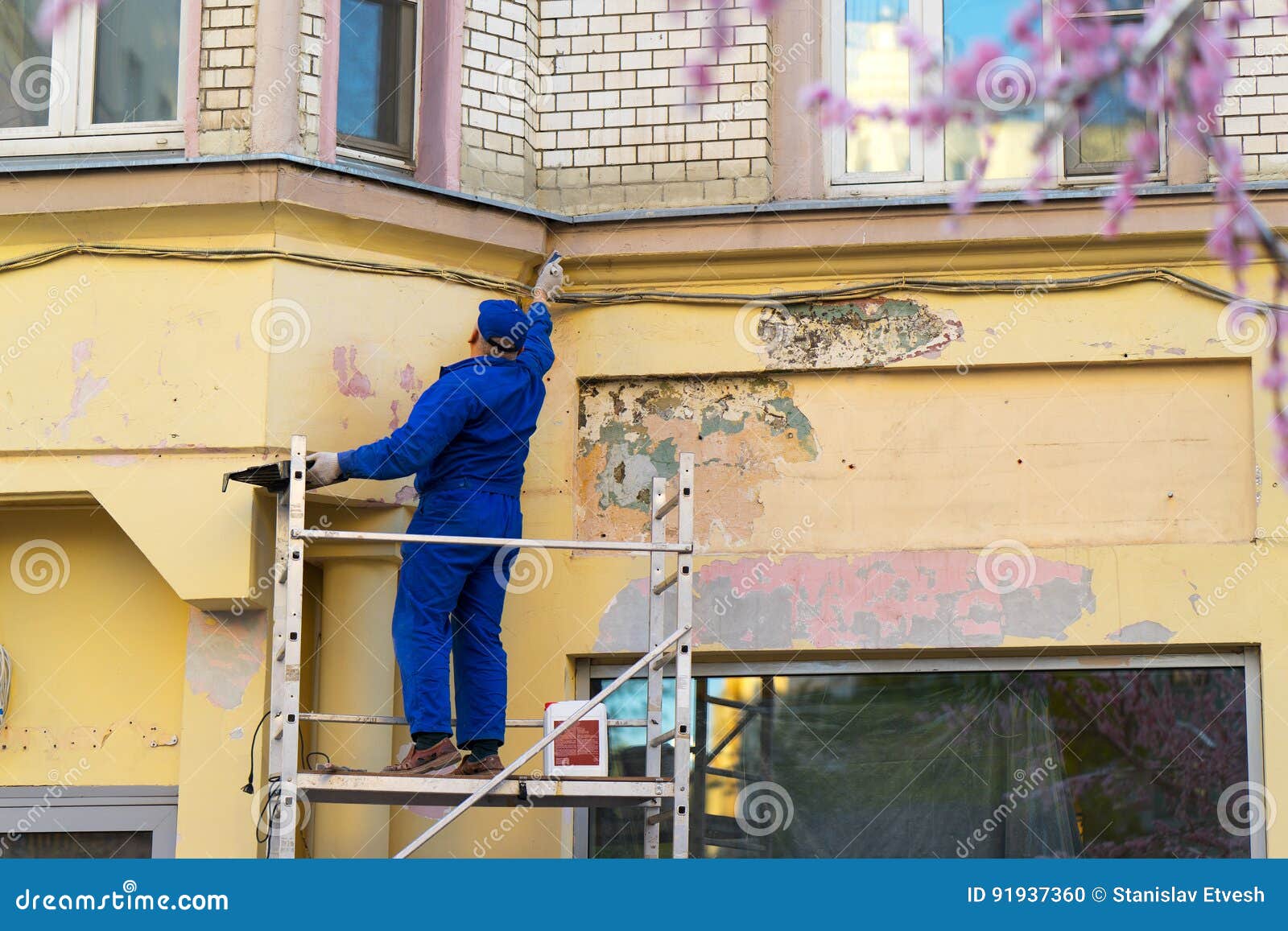 A Worker Repairing the Wall of a Building Editorial Image - Image of ...