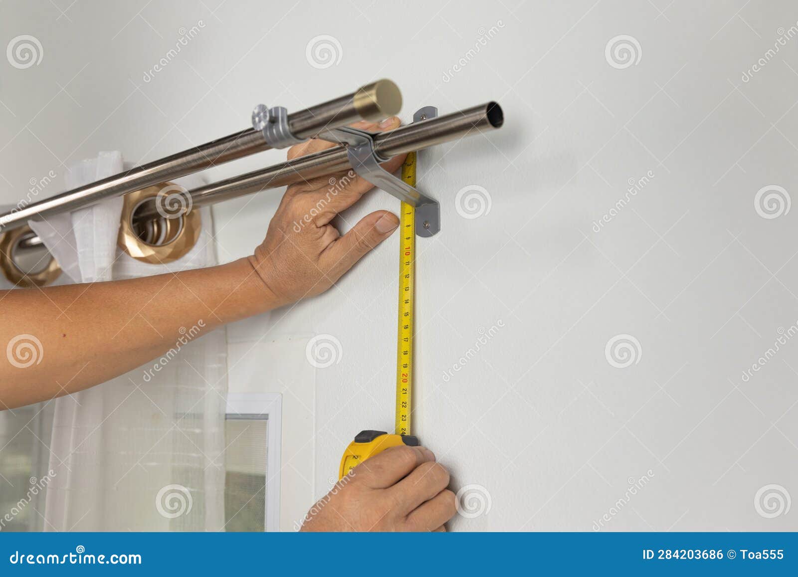 Worker Repairman Hanging and Fixing the Curtain on the Window Stock ...