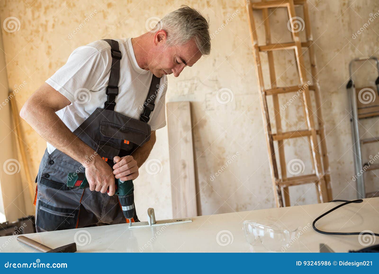 Worker Repairs the Door in a Carpenter`s Workshop Stock Photo - Image ...