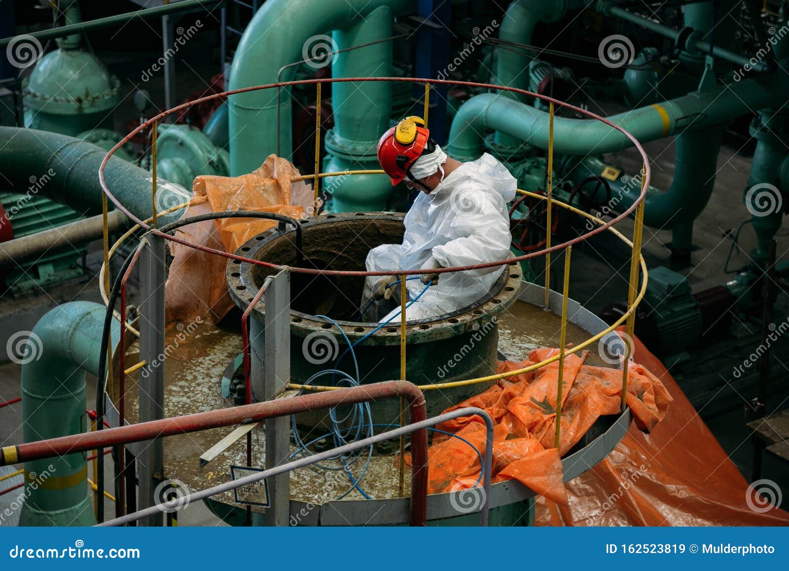 Worker Repairs Pipe Connections of Large Steel Tank Editorial Stock ...