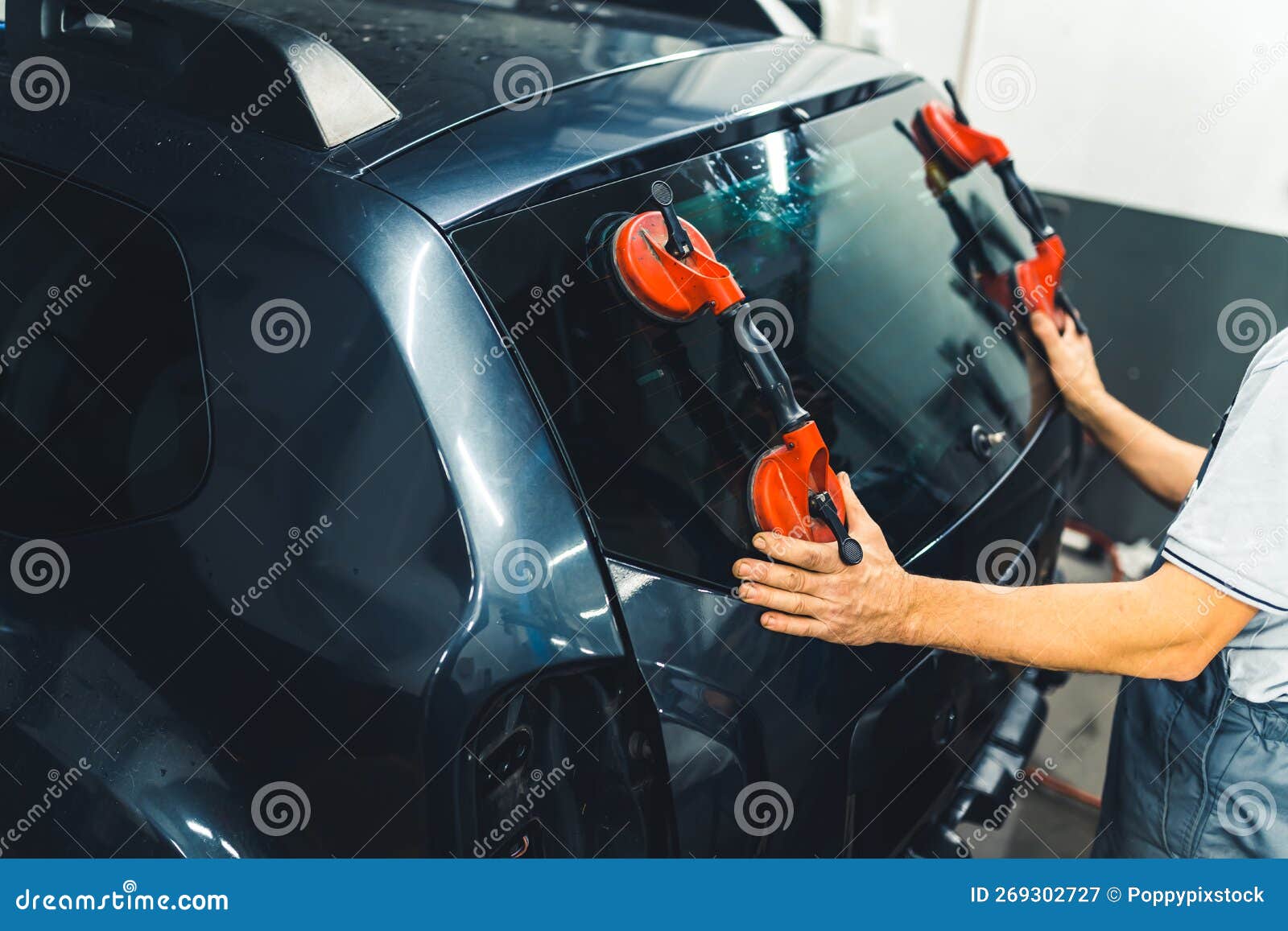 Worker Replacing Windscreen of Car in a Service Station Windshield ...