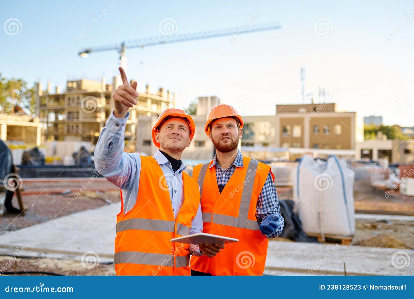 Worker Reporting To Contractor at Construction Site Stock Image - Image ...