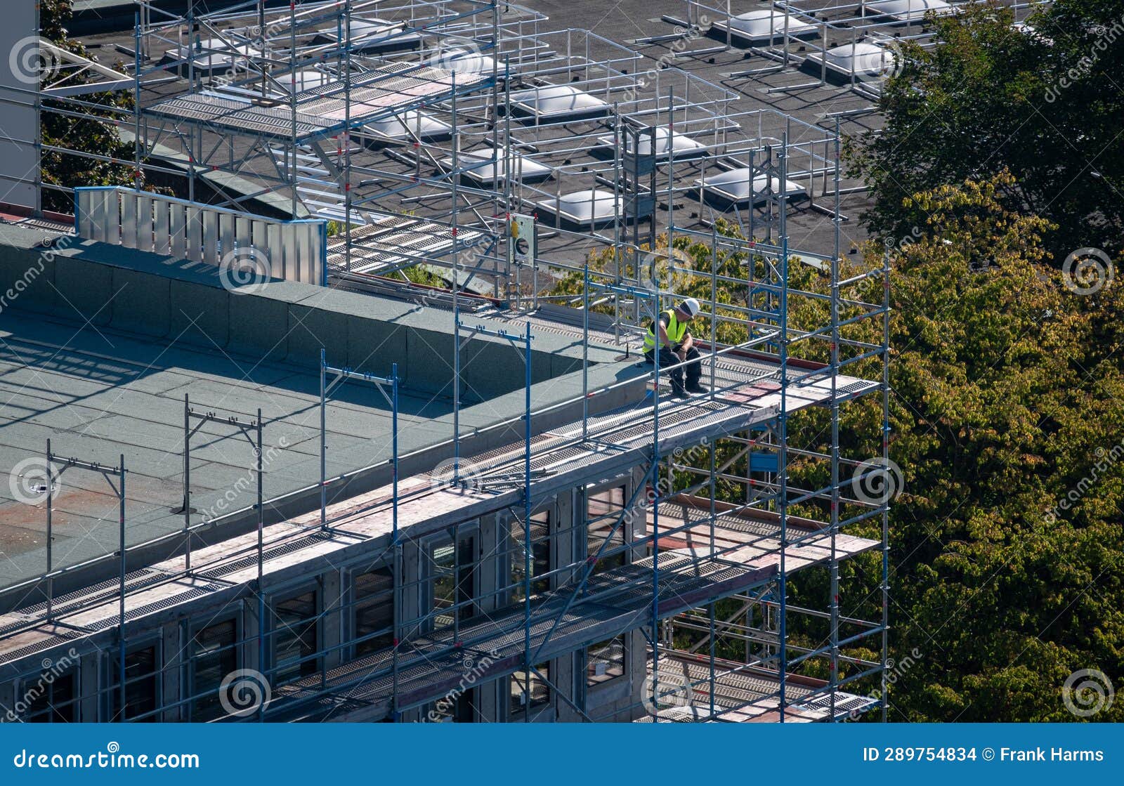 Worker Resting Alone on Top of a Construction Site. Stock Photo - Image ...