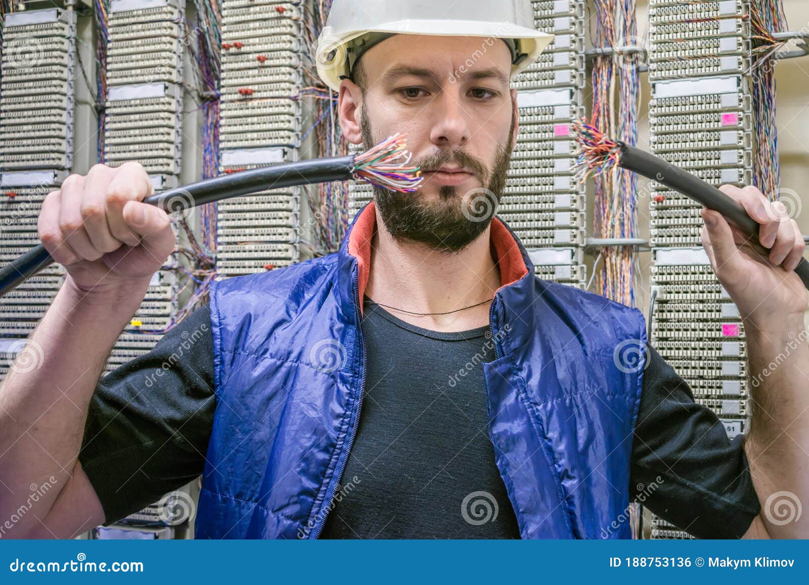 Worker Restores the Connection in the Data Center Server Room. Engineer ...