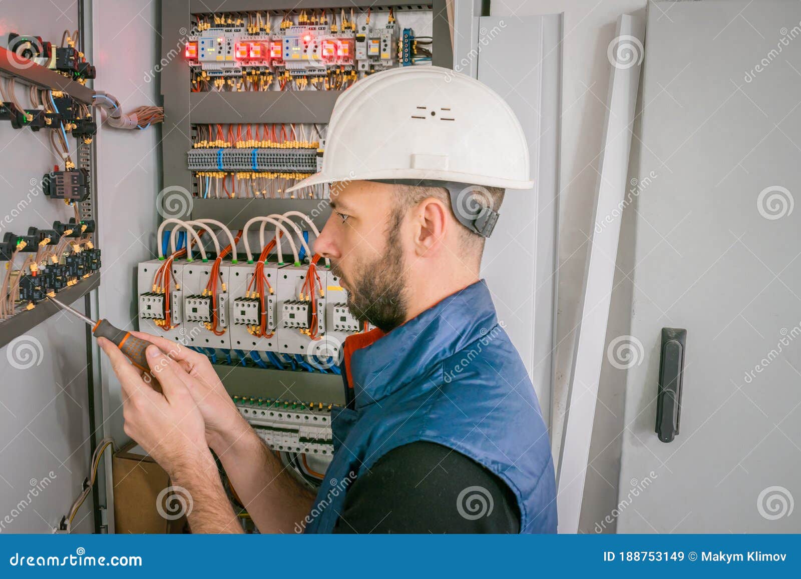 Worker Restores the Connection in the Data Center Server Room. Engineer ...