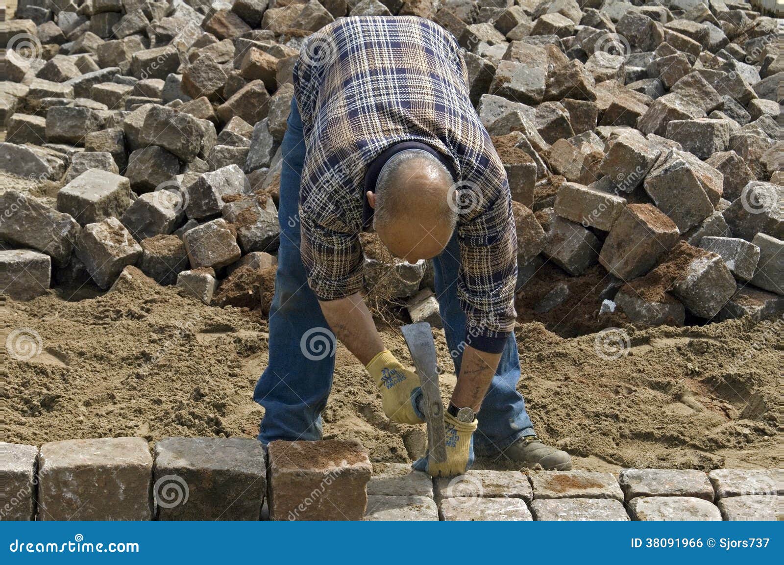 Worker: Road Builder Laying Cobblestones Editorial Photo - Image of ...