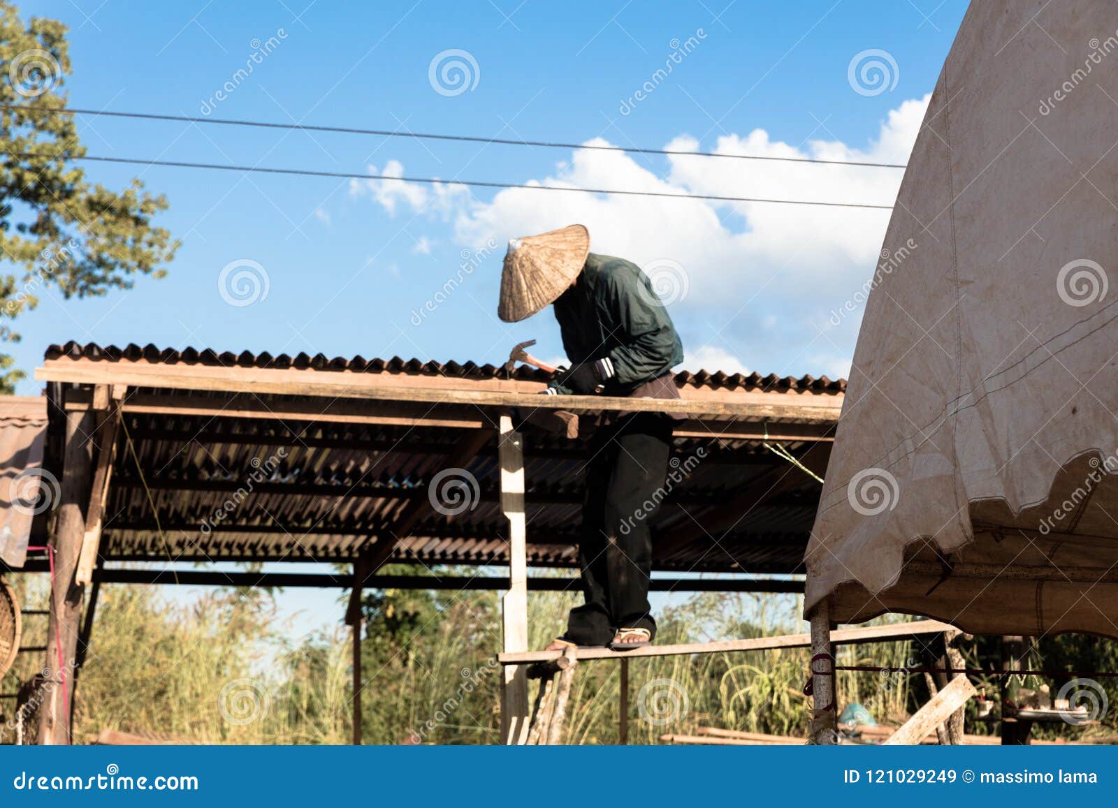 Worker on a roof stock image. Image of adult, building - 121029249
