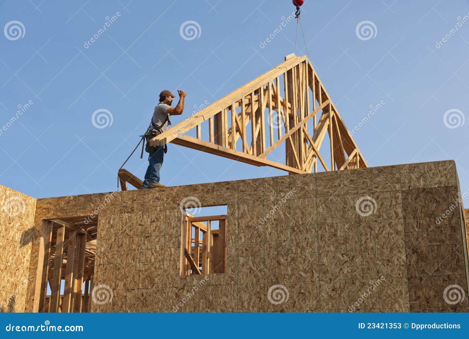 Worker with Roof Truss Frame Stock Image - Image of blue, single: 23421353