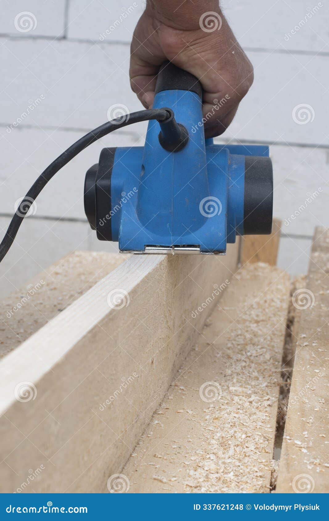 Worker is planing boards stock photo. Image of carpentry - 337621248